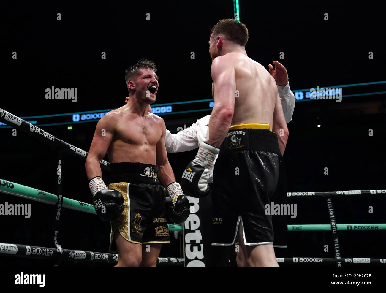 Rhys Edwards hugs Brian Phillips following his victory in the super ...