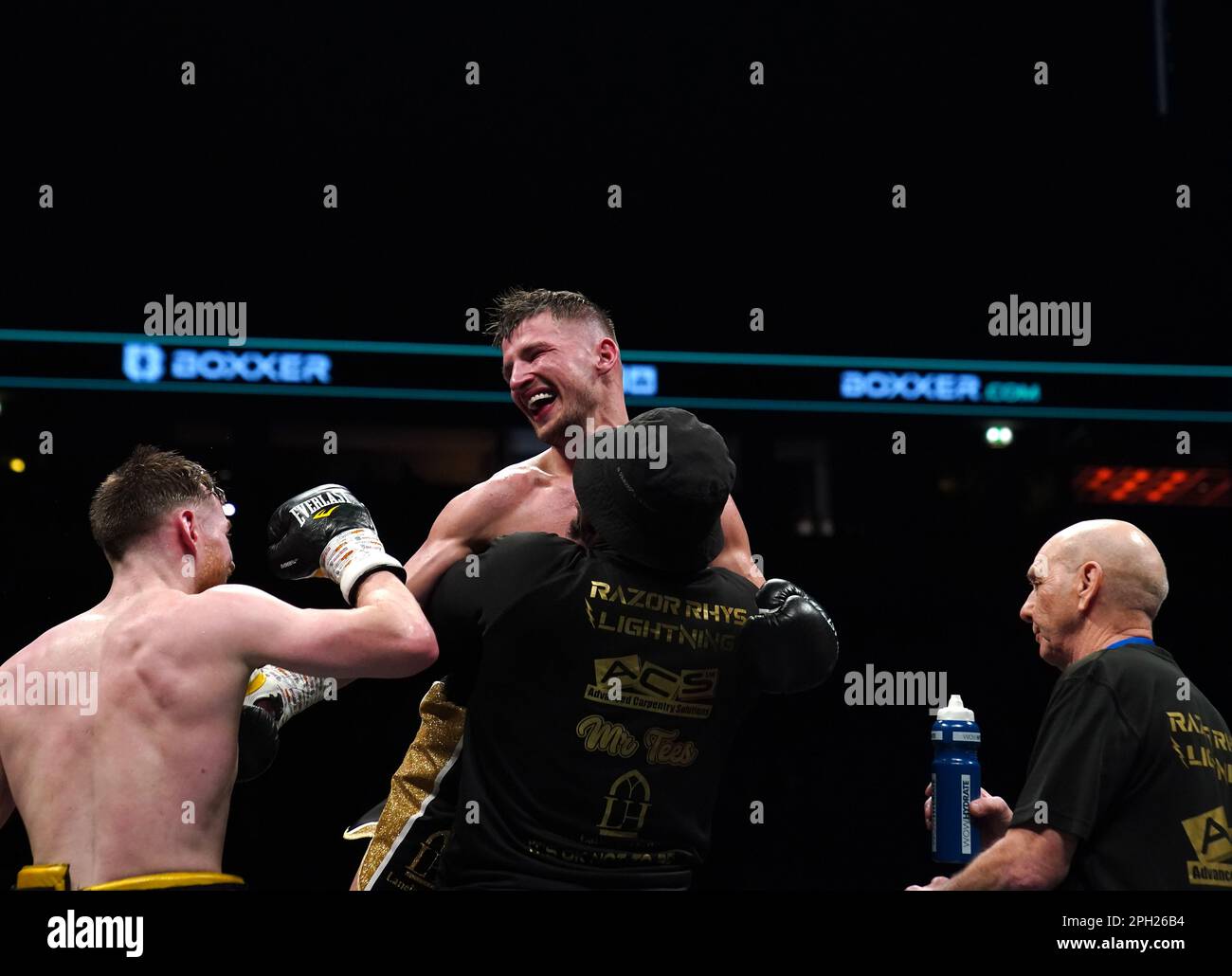 Rhys Edwards celebrates victory in the super featherweight bout at the ...