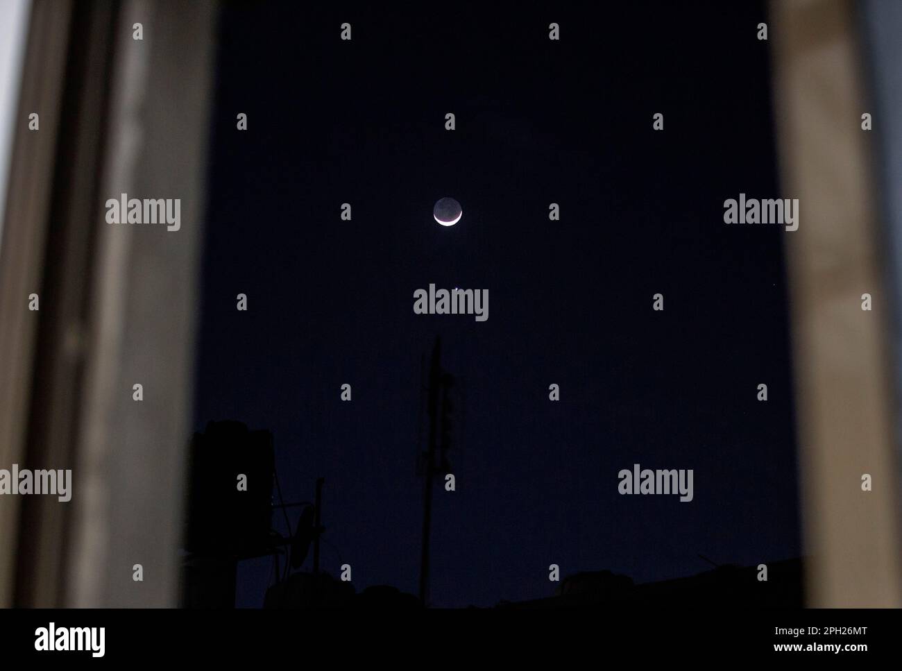 The crescent moon appears in the sky of Gaza, on the third day of the ...
