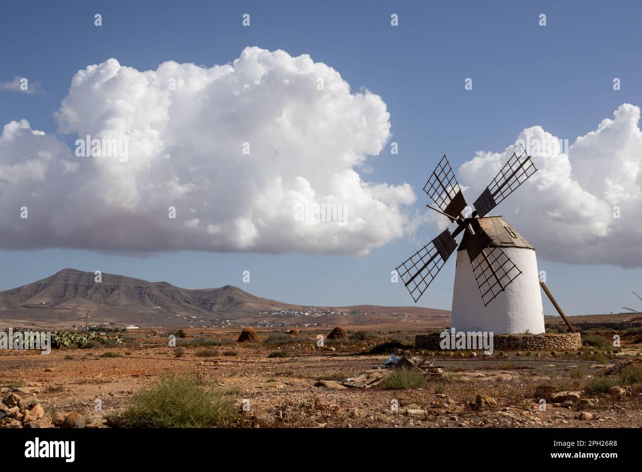 Round shape of the white windmill. Traditional way of grounding the ...