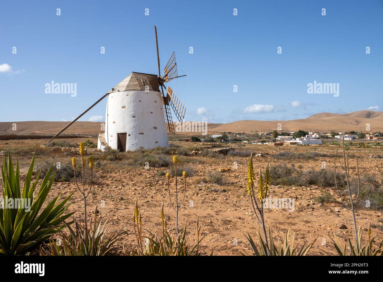 Round shape of the white windmill. Traditional way of grounding the ...