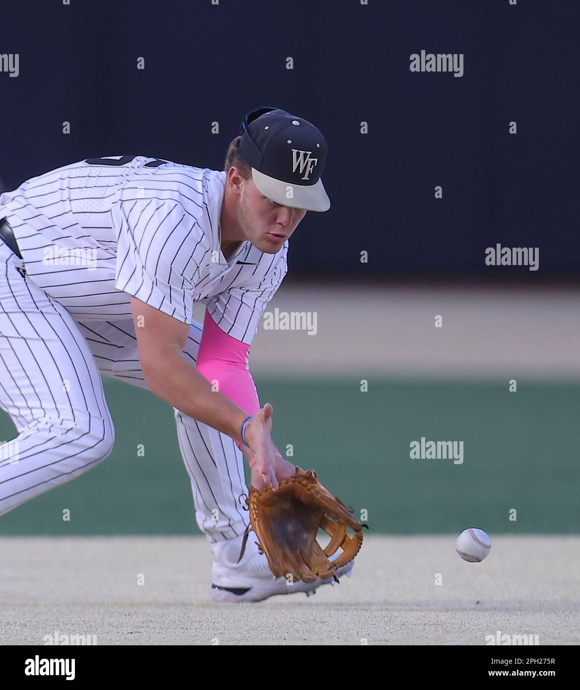 March 24, 2023: Wake Forest University junior Brock Wilken (25) fields ...