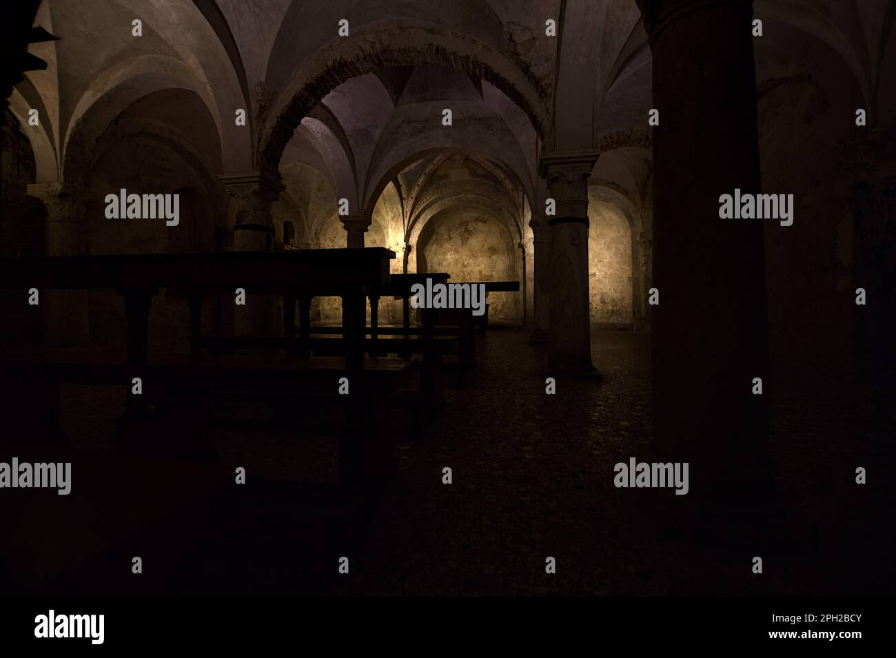 Crypt with benches and altar in the old dome of Brescia Stock Photo - Alamy