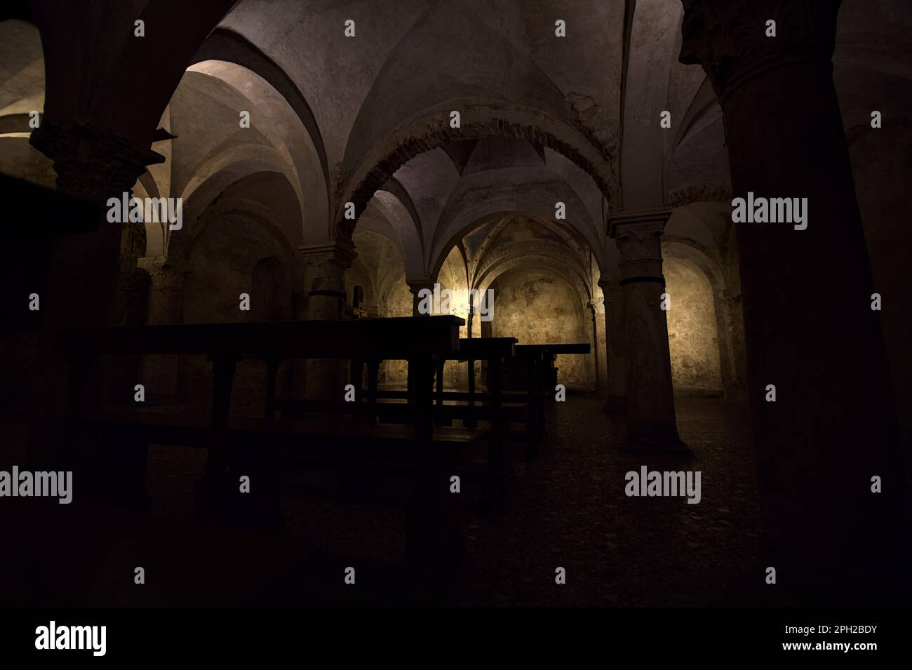 Crypt with benches and altar in the old dome of Brescia Stock Photo - Alamy