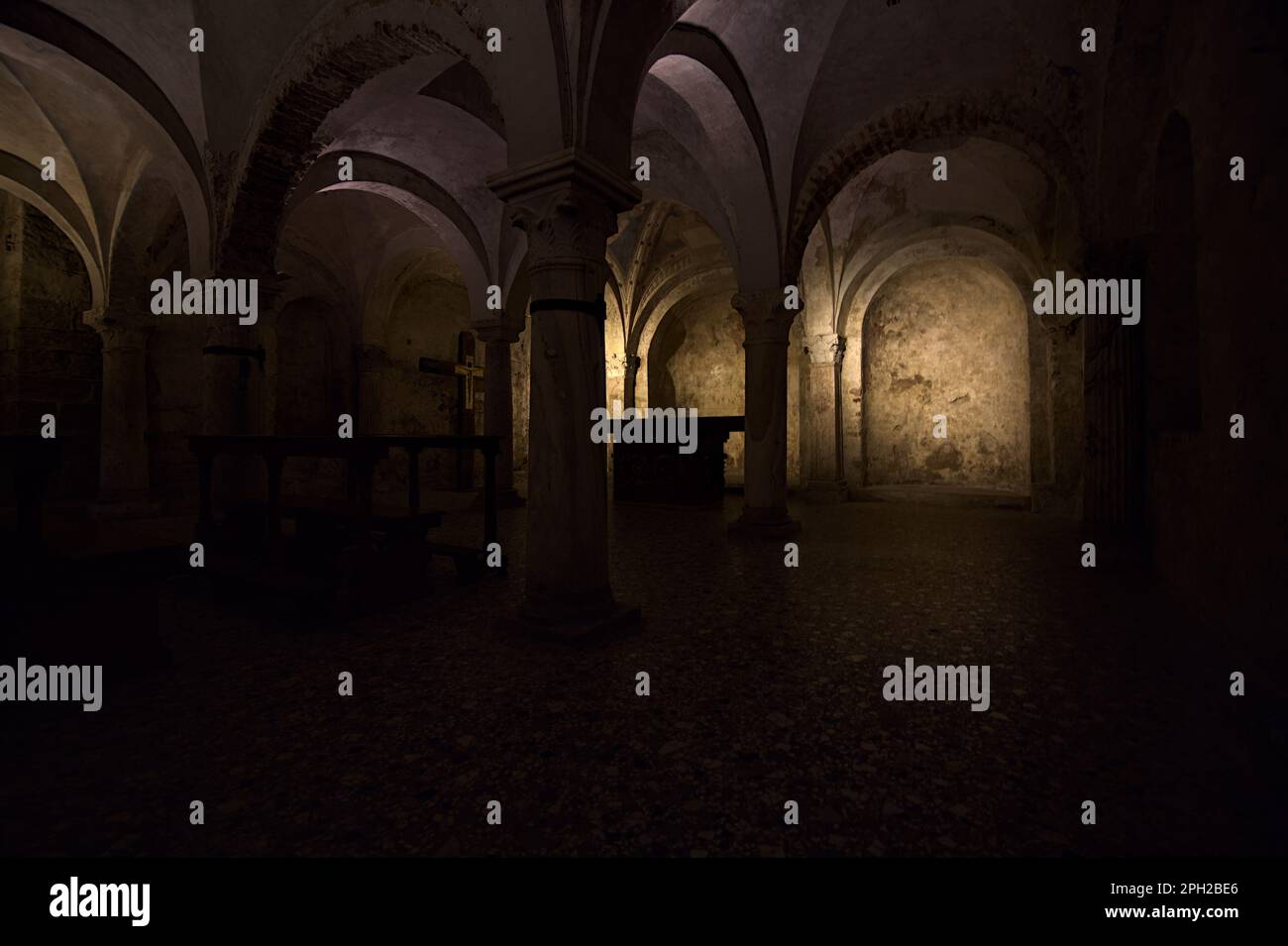 Crypt with benches and altar in the old dome of Brescia Stock Photo - Alamy