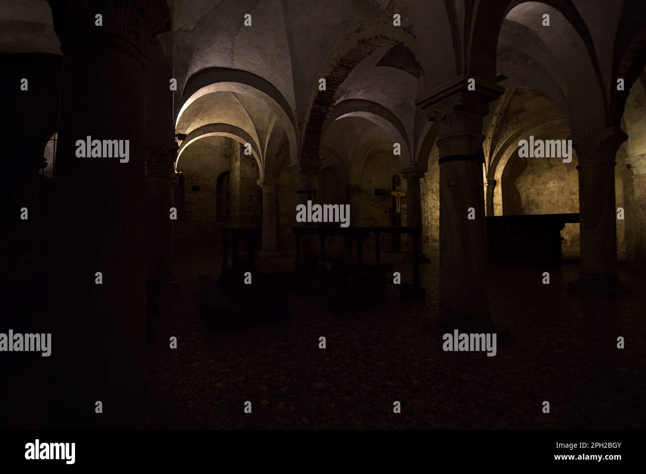 Crypt with benches and altar in the old dome of Brescia Stock Photo - Alamy