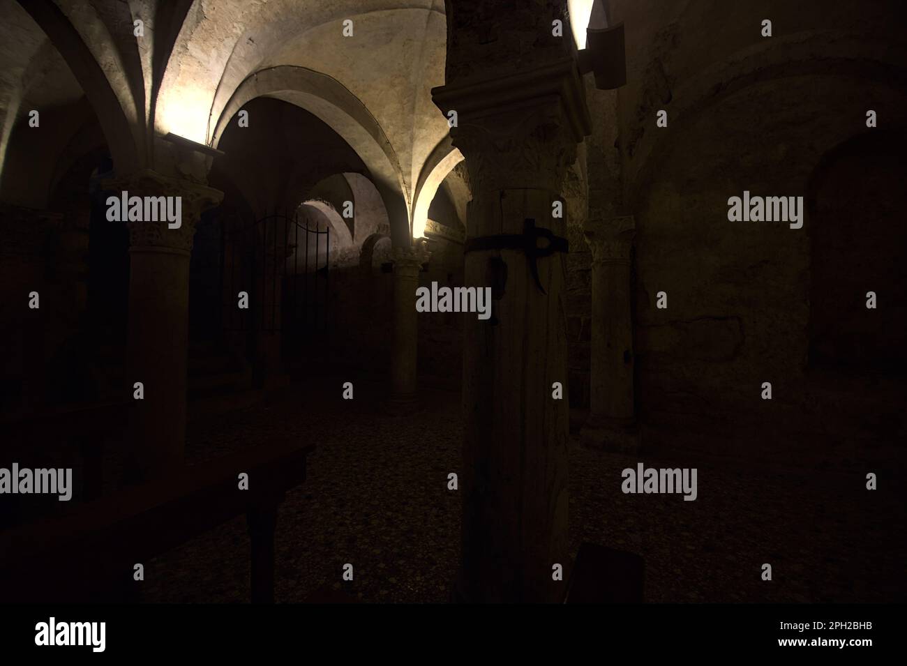 Crypt with benches and altar in the old dome of Brescia Stock Photo - Alamy