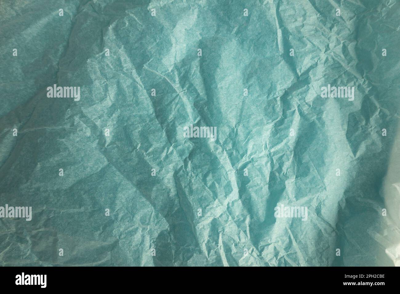 Light blue crumpled paper texture background Stock Photo - Alamy