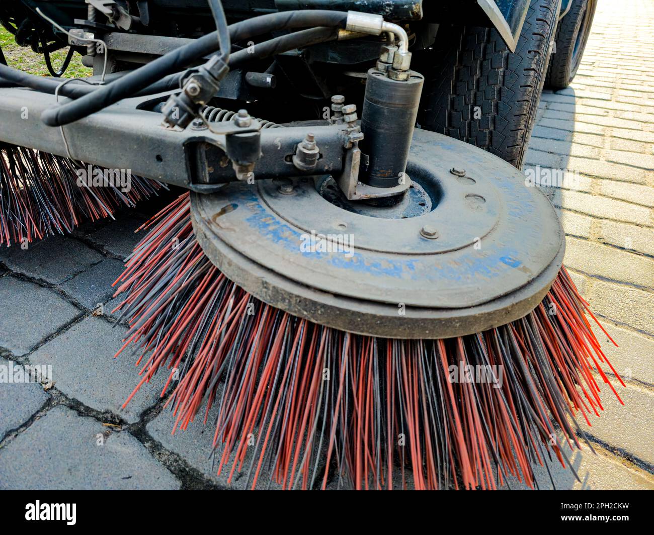 Close-up sweeper machine cleaning. Concept clean streets from debris ...