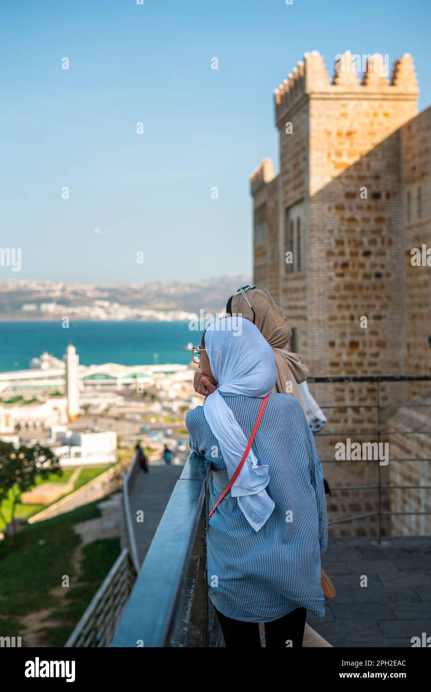 Two muslim girls looking over the port of Tanger Stock Photo - Alamy