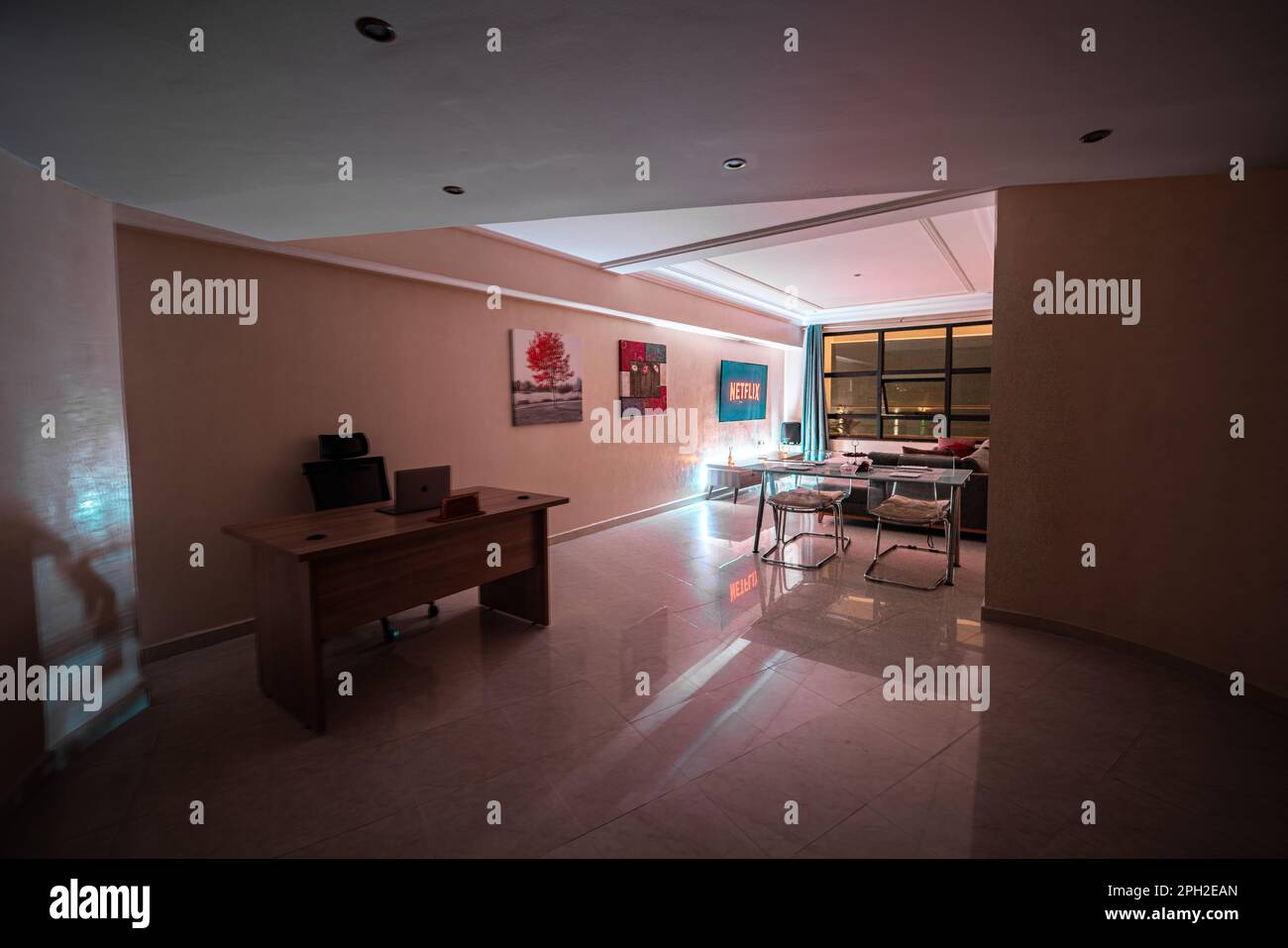 Cozy living room with the Netflix logo on a large smart TV Stock Photo ...