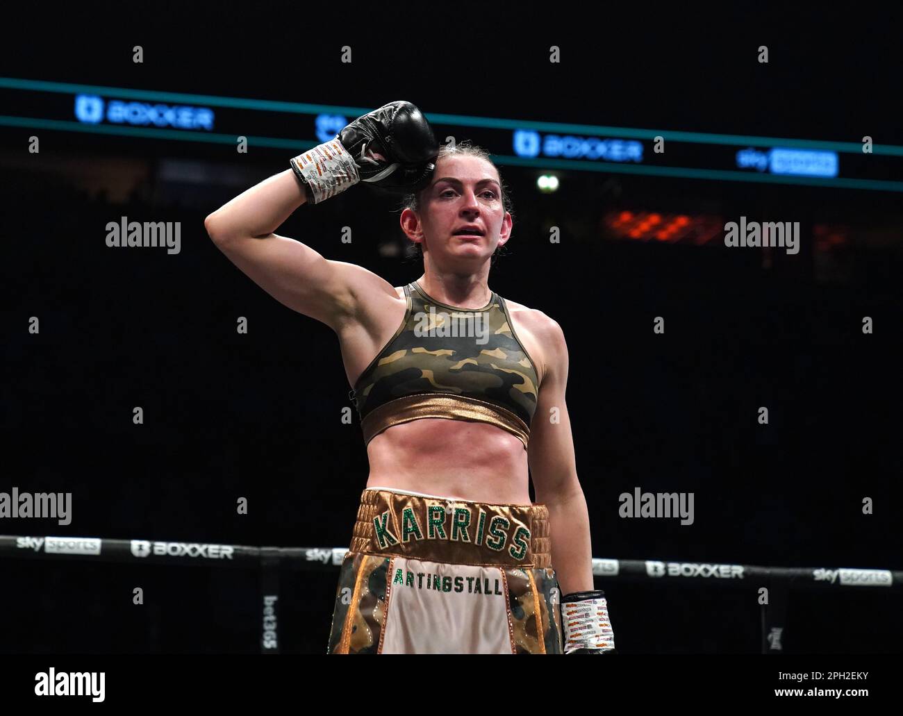 Karriss Artingstall celebrates victory in the super featherweight bout ...