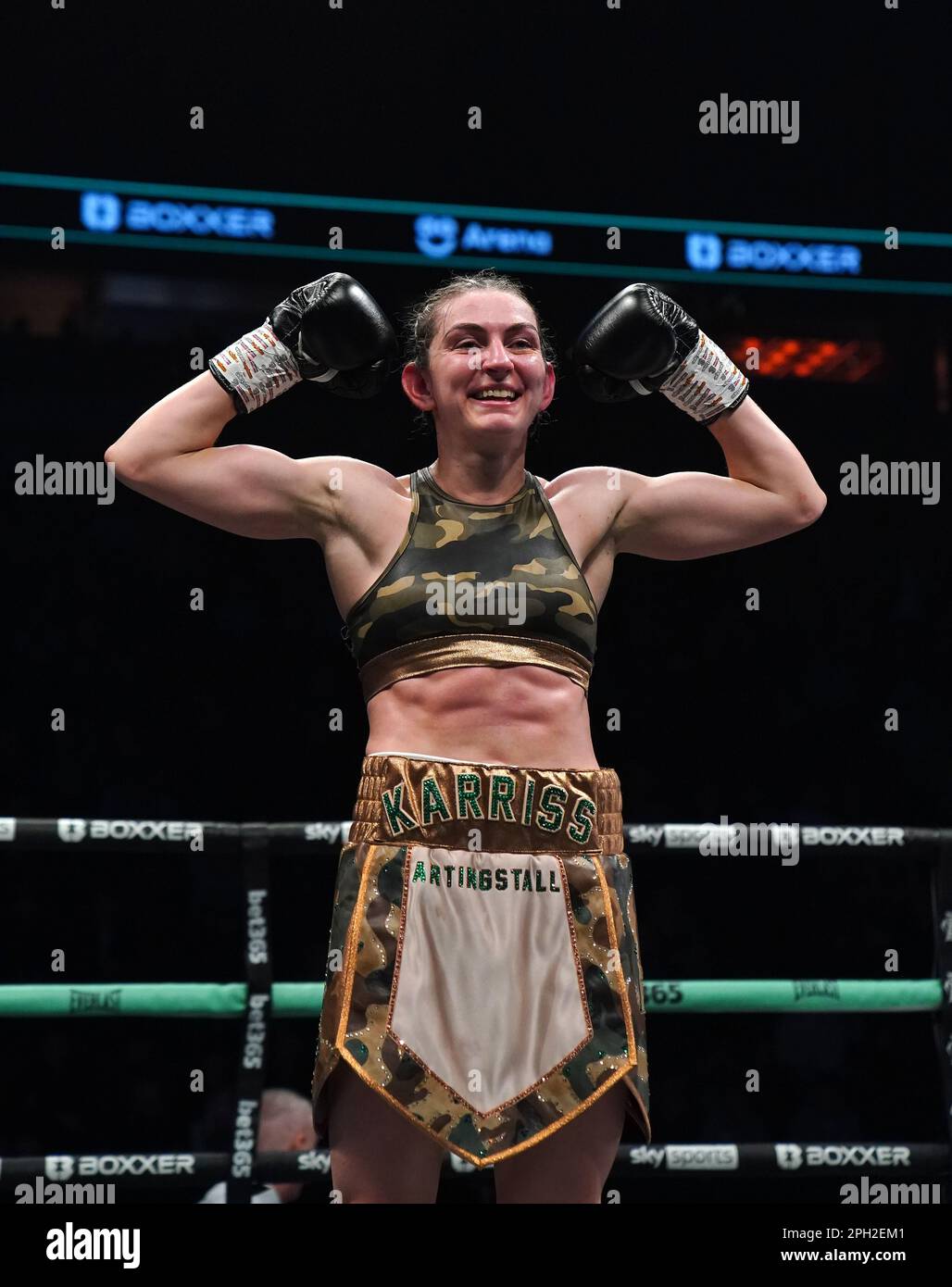 Karriss Artingstall celebrates victory in the super featherweight bout ...