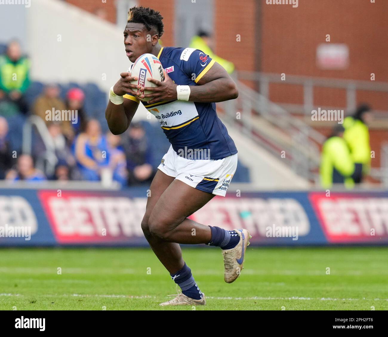 Leeds, UK. 25th Mar, 2023. Justin Sangare #17 of Leeds Rhinos makes a ...