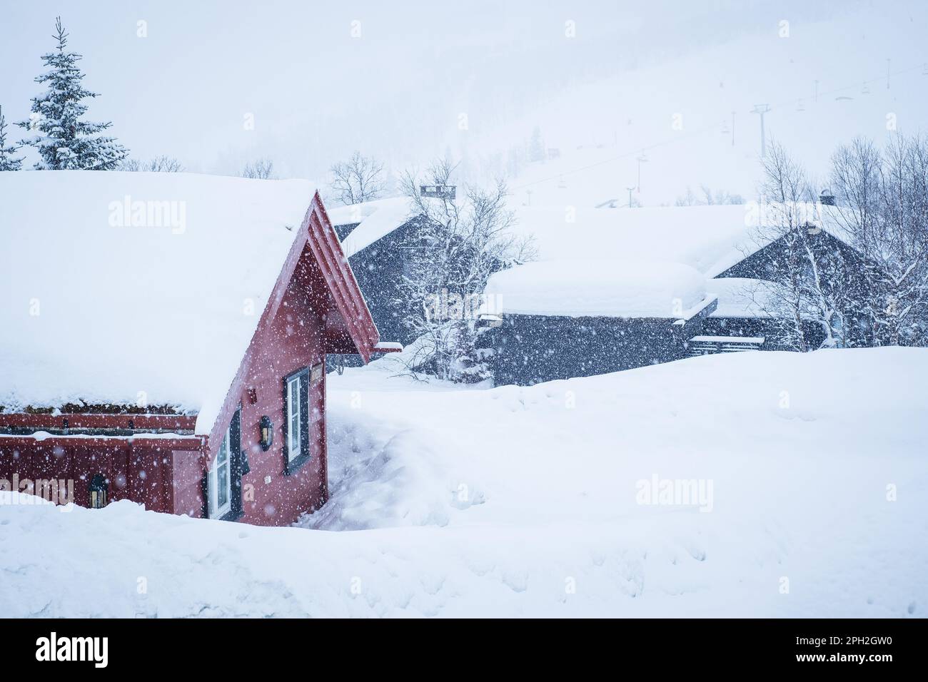 Cozy wooden cabin under snow in the mountains during winter Stock Photo ...