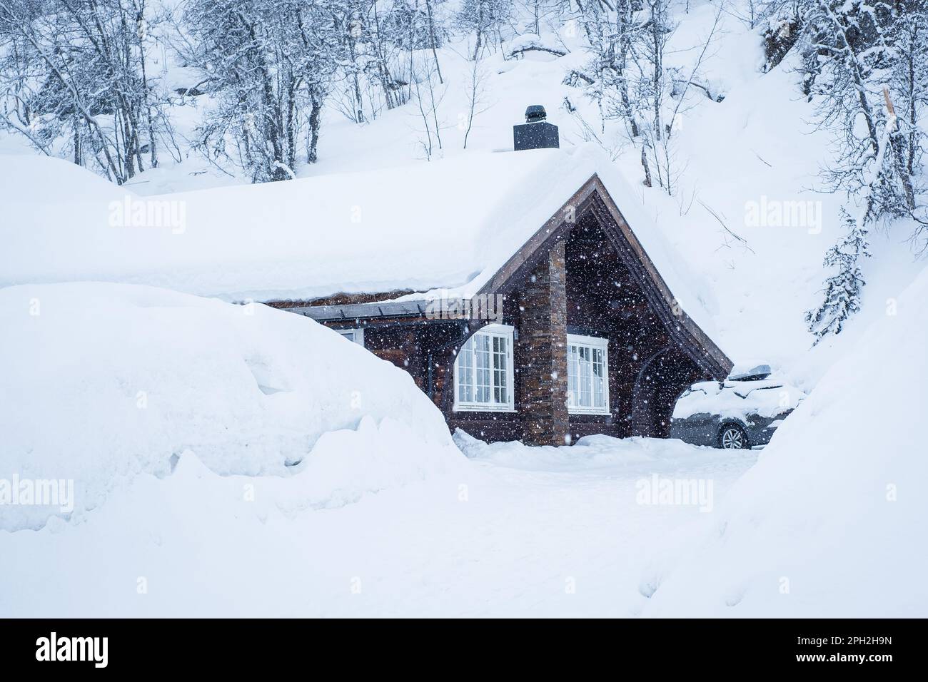 Cozy wooden cabin under snow in the mountains during winter Stock Photo ...