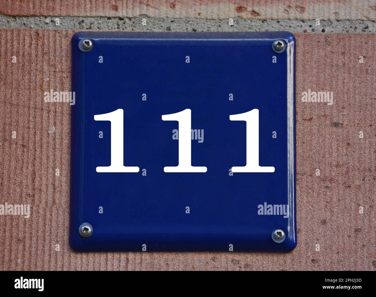 A blue house number plaque, showing the number hundred and eleven (111 ...