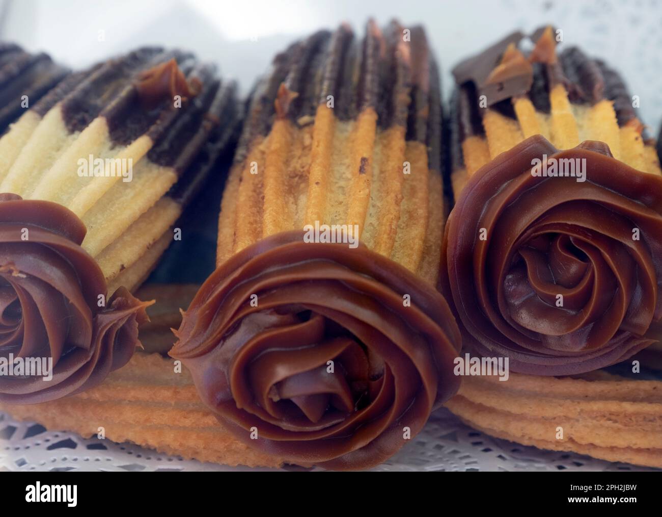 Traditional Spanish desert churro with cream Stock Photo - Alamy