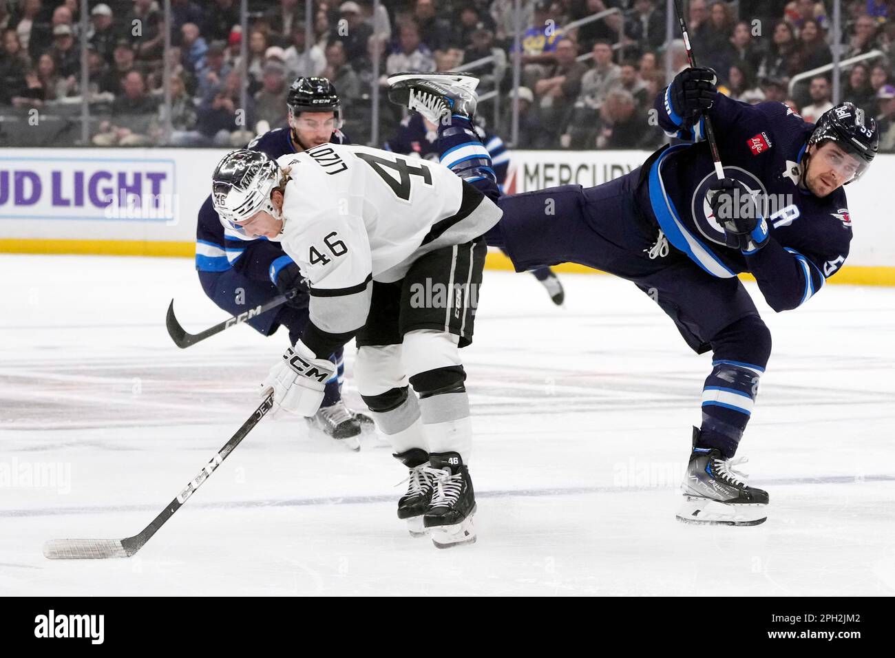 Winnipeg Jets center Mark Scheifele, right, collides with Los Angeles ...