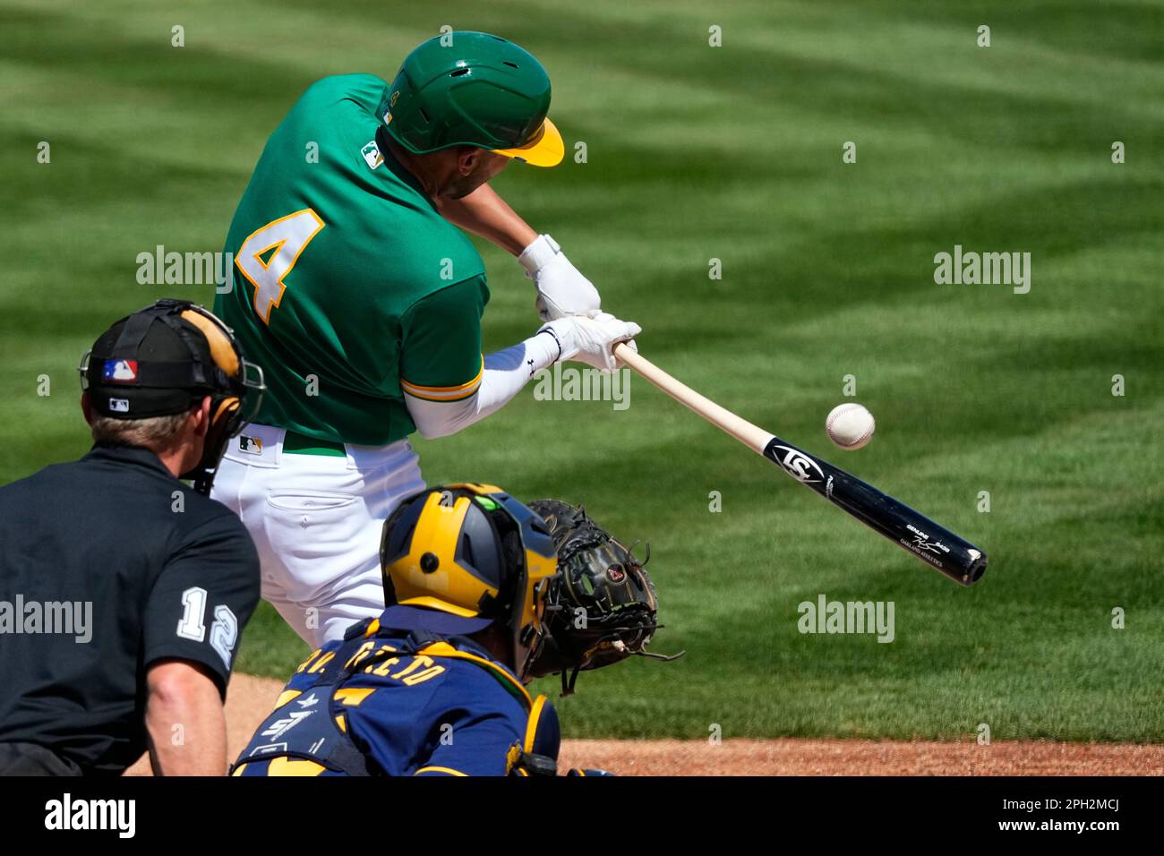 Oakland Athletics' Kevin Smith (4) connects for an RBI base hit against ...