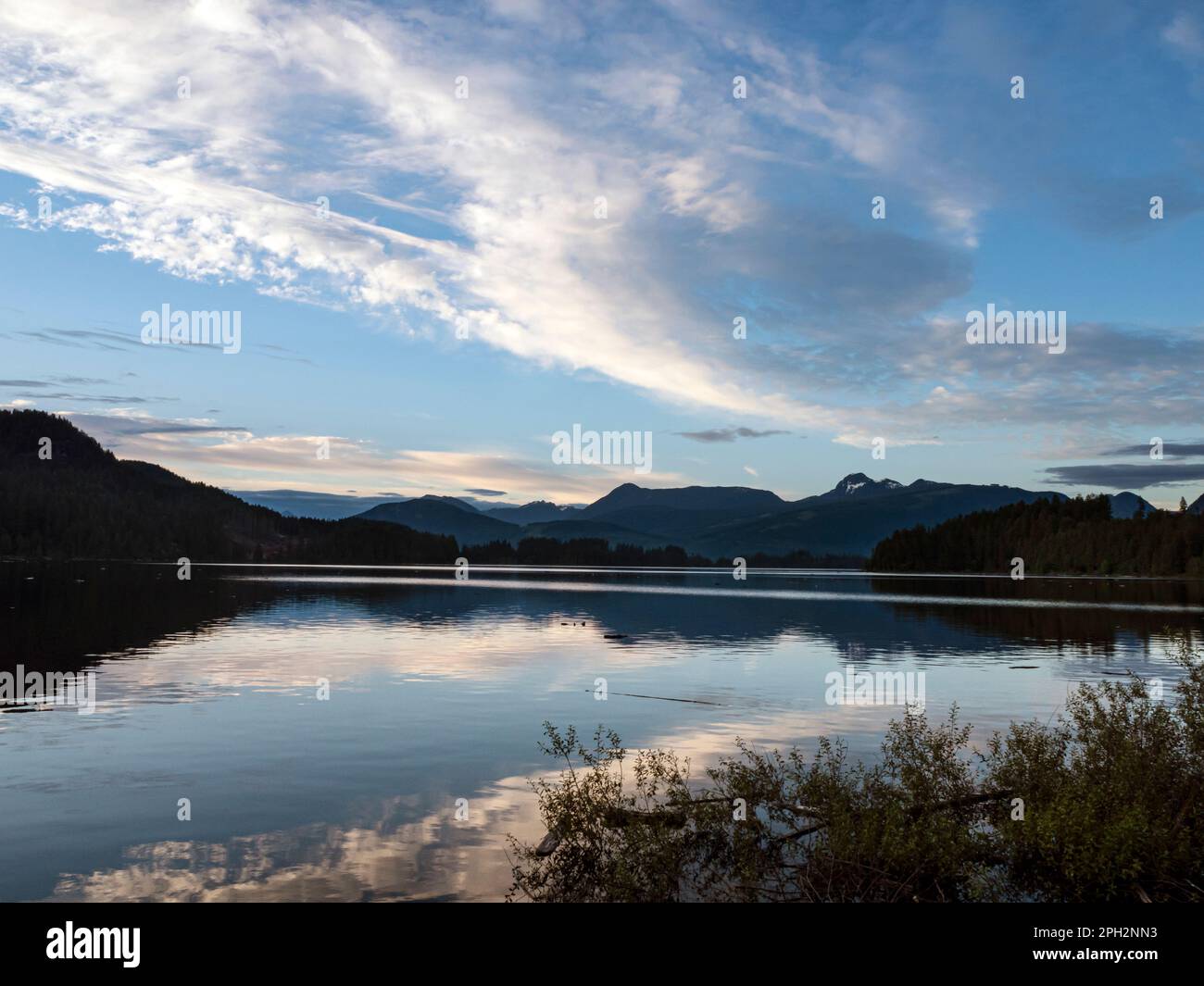 BC00732-00...BRITISH COLUMBIA - Clouds reflecting on Lois Lake at ...