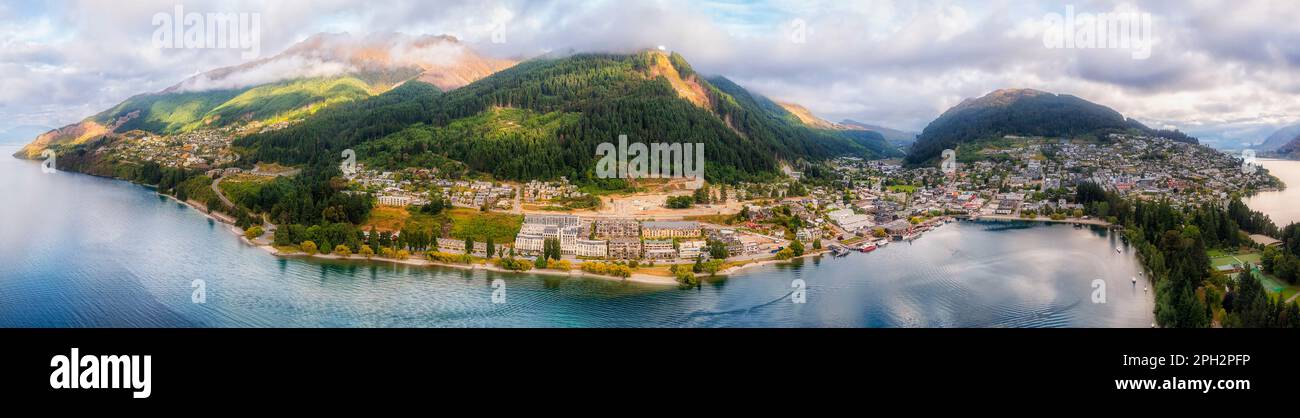 Scenic mountain waterfront of hotels and streets in Queenstown town of ...