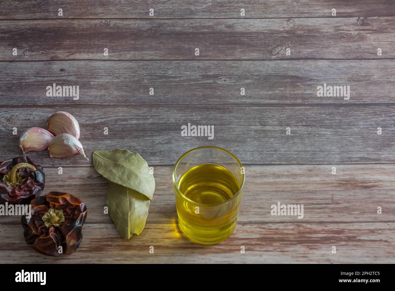 oil and spices on table for background Stock Photo - Alamy