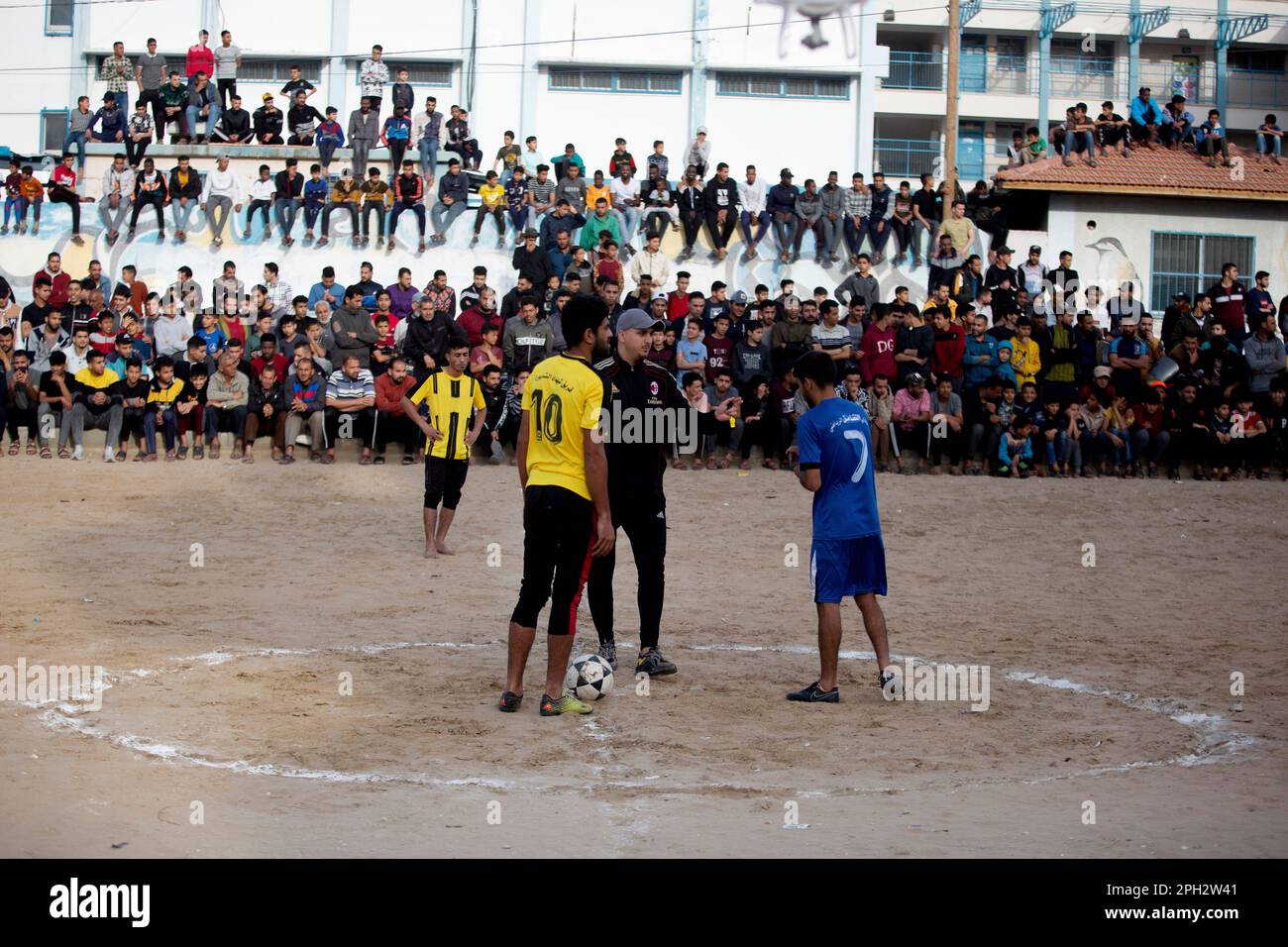 Palestinian youths play football during the holy month of Ramadan in ...