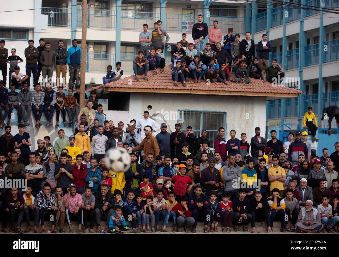 Spectators watch a football game during the holy month of Ramadan in ...
