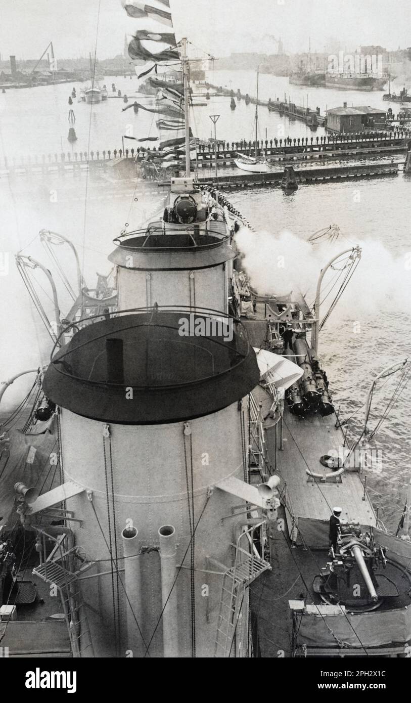 The Royal Navy light cruiser HMS Danae in Copenhagen, firing a salute ...