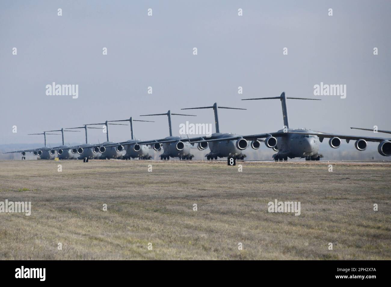 C-17 Globemaster IIIs taxi down the Altus Air Force Base (AFB ...