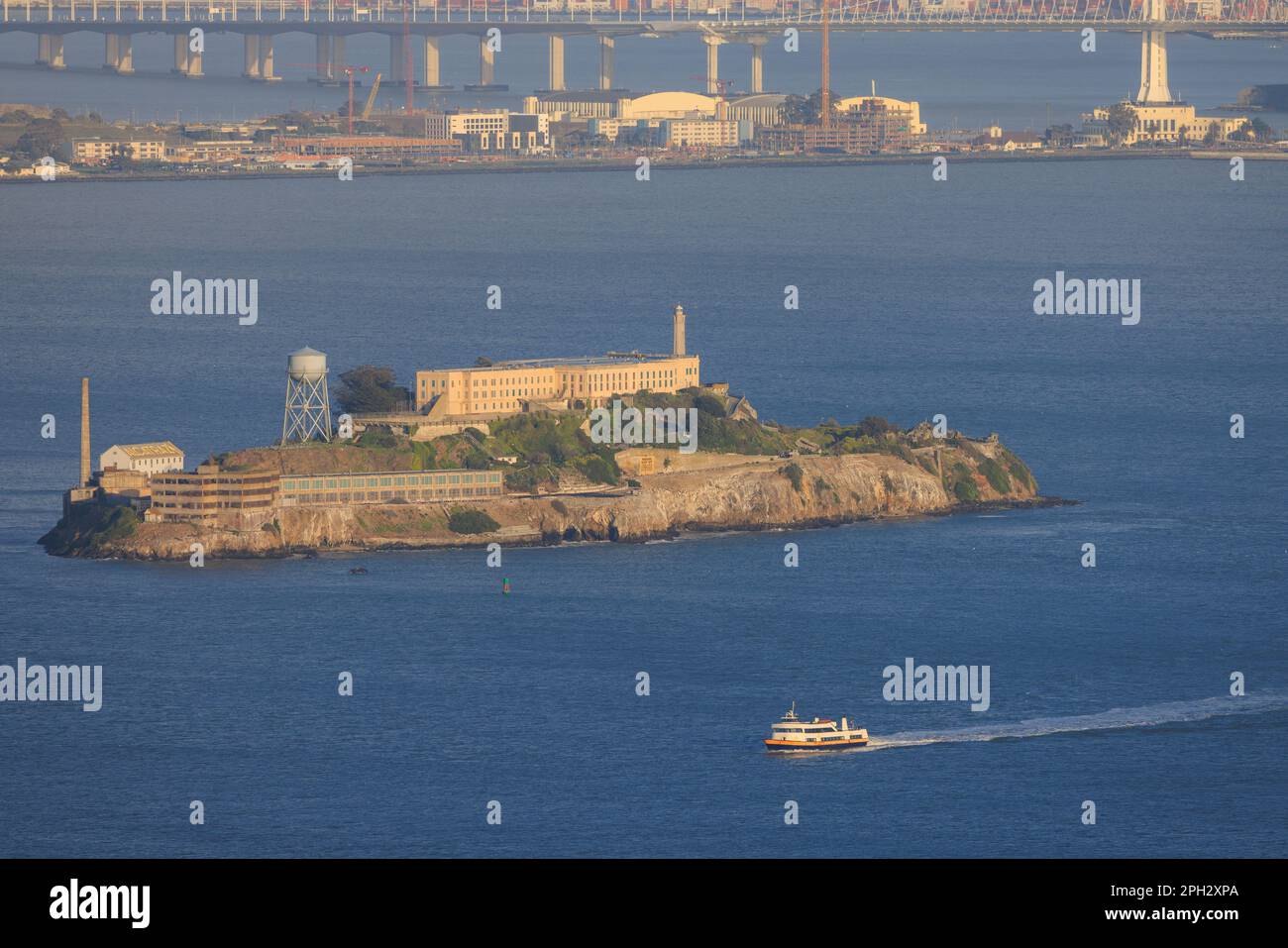 Alcatraz Island and sightseeing ferry in San Francisco Bay at Golden ...