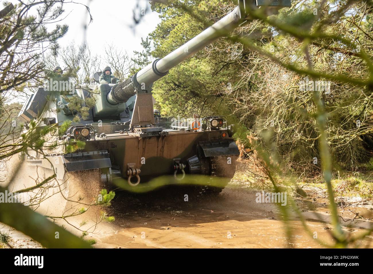 Polish soldiers assigned to the Multinational Field Artillery Brigade ...
