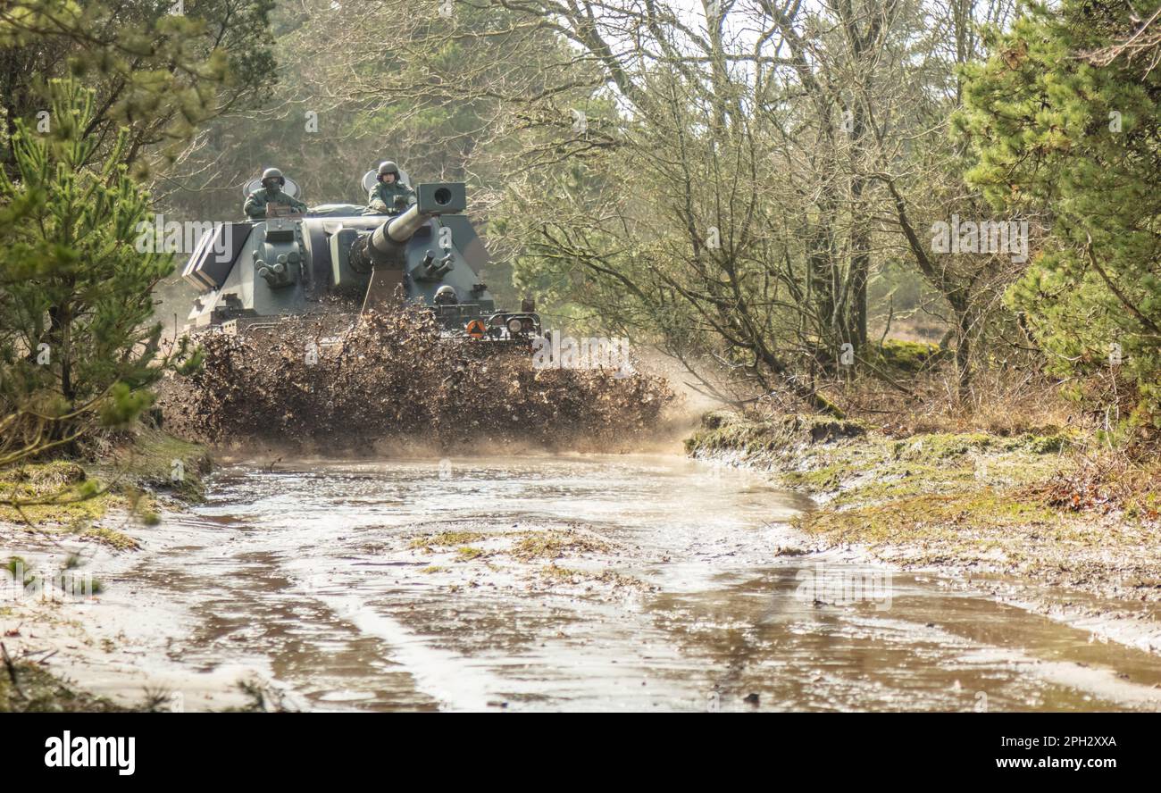 Polish soldiers assigned to the Multinational Field Artillery Brigade ...