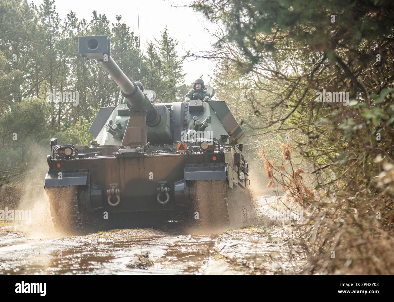 Polish soldiers assigned to the Multinational Field Artillery Brigade ...