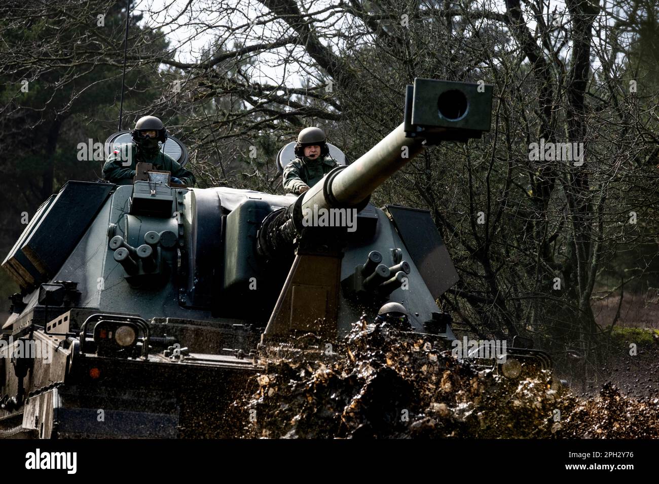 Polish Krab crews perform tactical maneuvers in rough terrain in ...