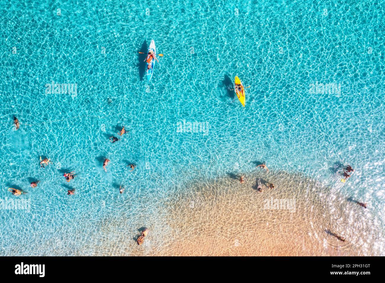 Aerial view of kayaks, swimming people in blue sea, sandy beach Stock ...