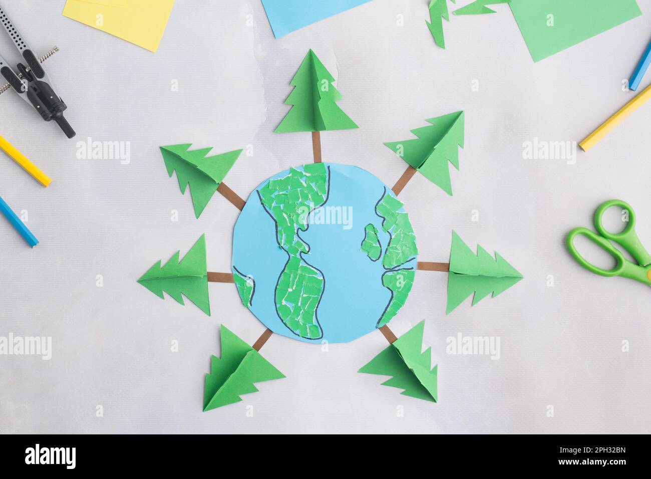 earth cut from paper around trees earth day concept kid's paper craft ...