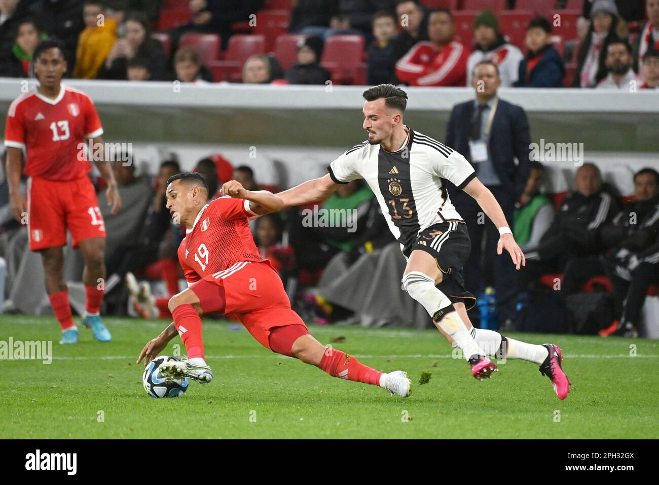 Mainz, Deutschland. 25th Mar, 2023. Mergim BERISHA (GER), action, duels versus Yoshimar YOTUN ...