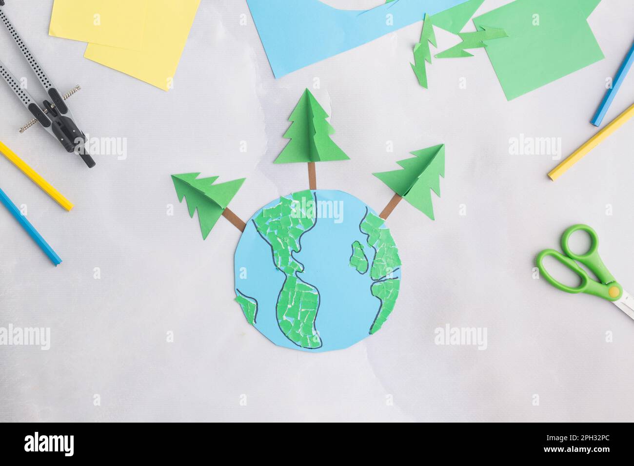 earth cut from paper around trees earth day concept kid's paper craft ...