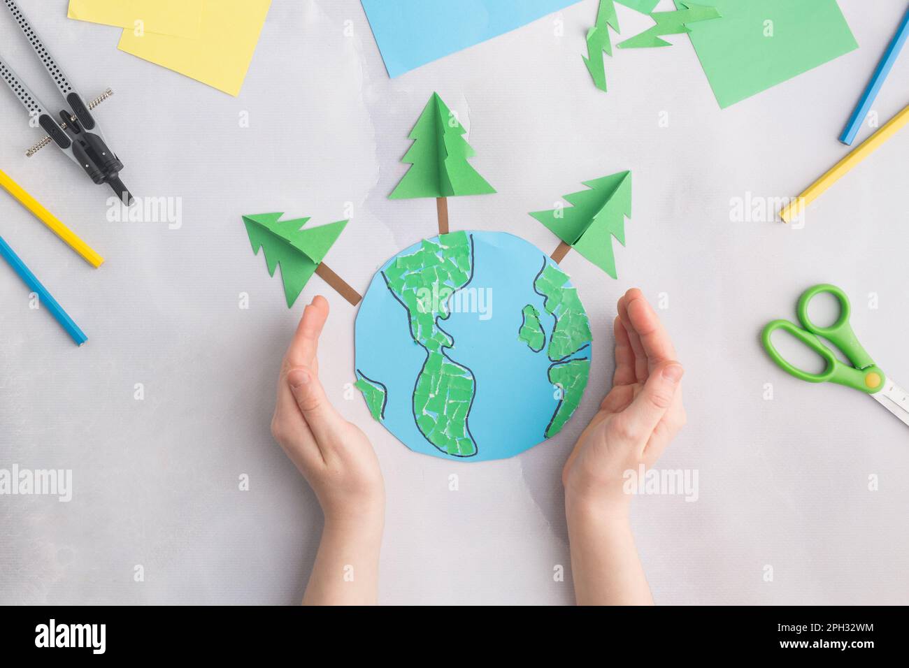 earth cut from paper around trees earth day concept kid's paper craft ...