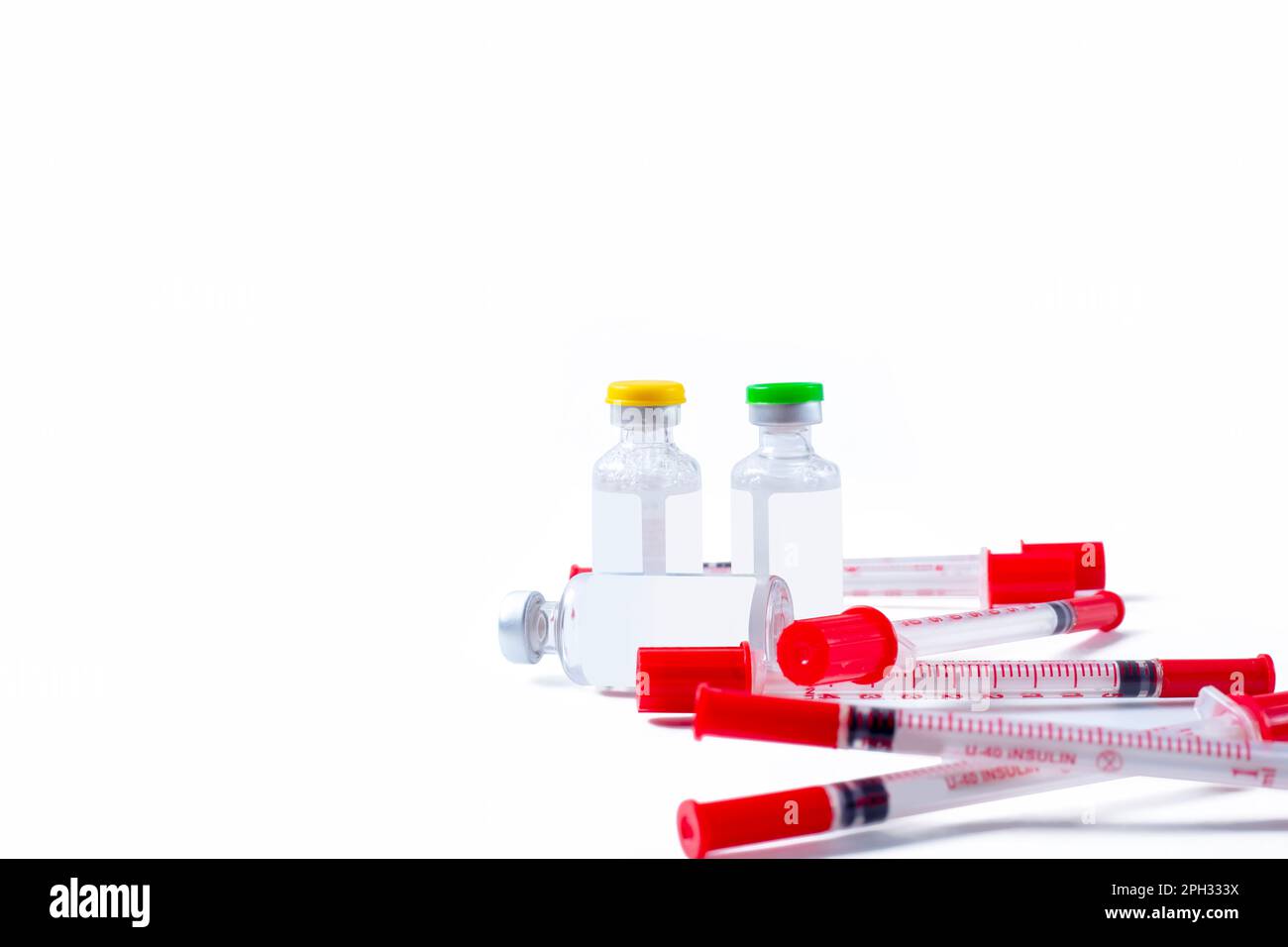 Medical vials and syringes isolated on white background with copy space ...