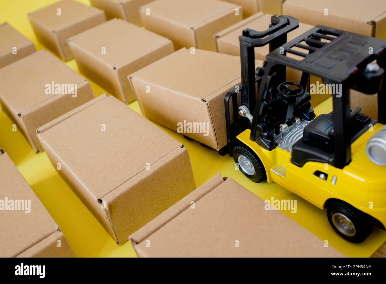 Warehouse with cardboard kraft boxes and a forklift truck. Cargo ...