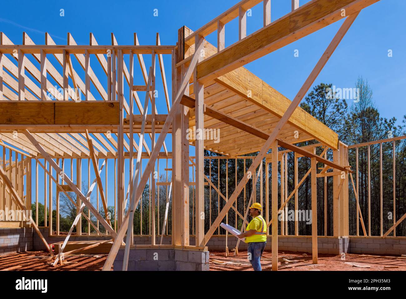 Architect checks building blueprints on hi-res stock photography and ...
