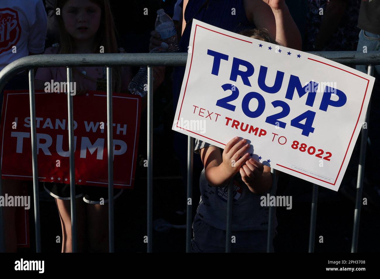 A kid holds a placard during former U.S. President Donald Trump's first ...