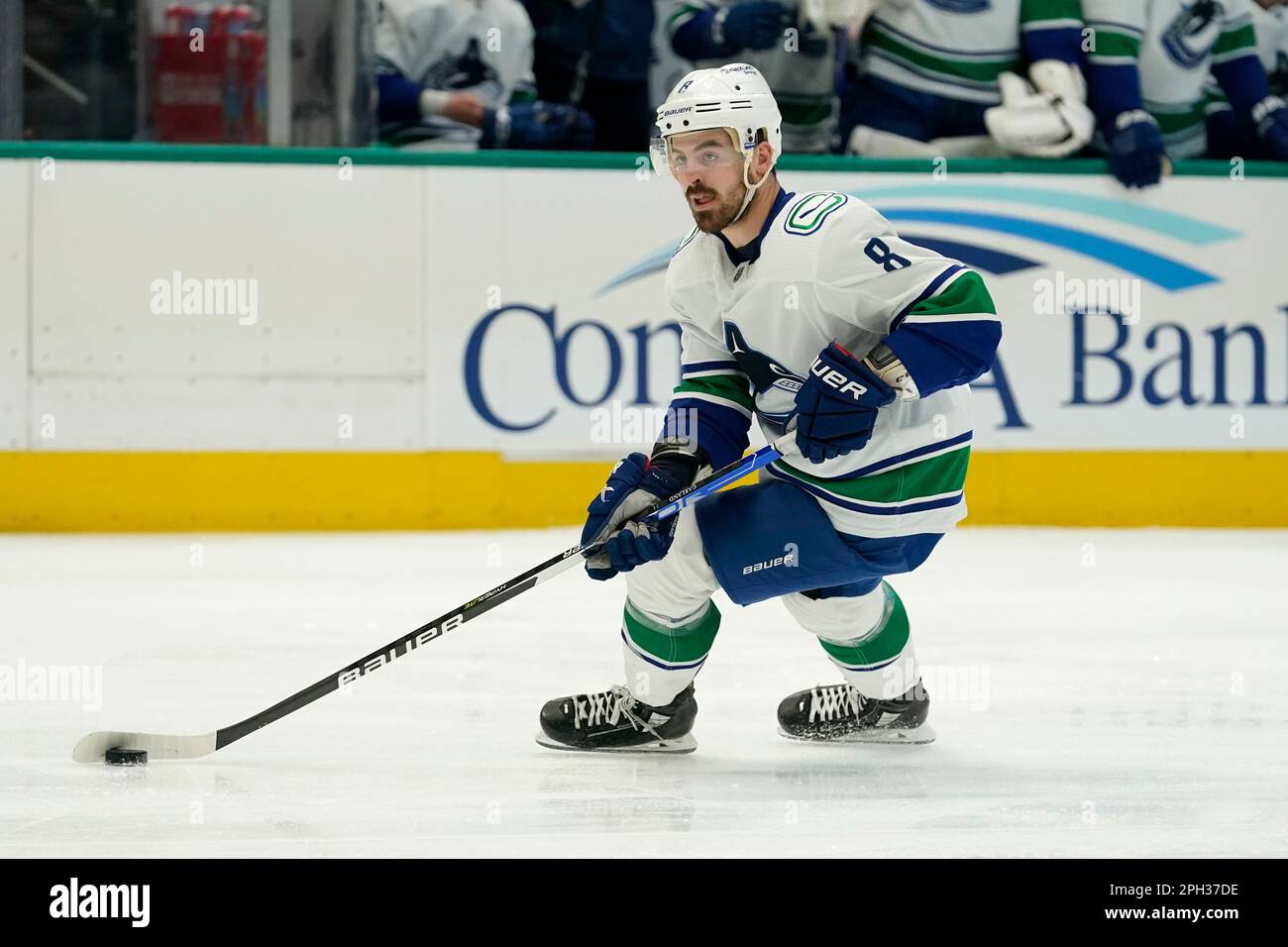 Vancouver Canucks right wing Conor Garland (8) skates with the puck ...