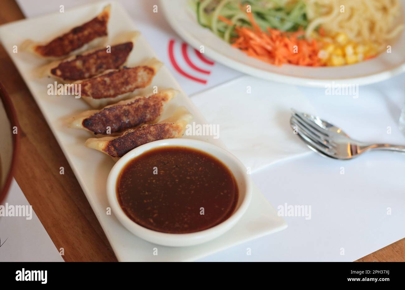 Vegetarian Gyoza and soy sauce Stock Photo - Alamy