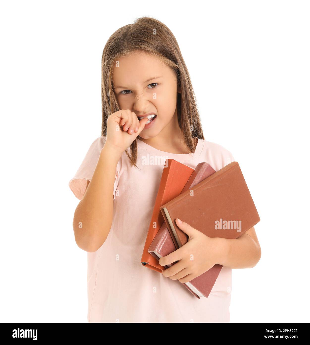 Angry little girl biting nails on white background Stock Photo - Alamy