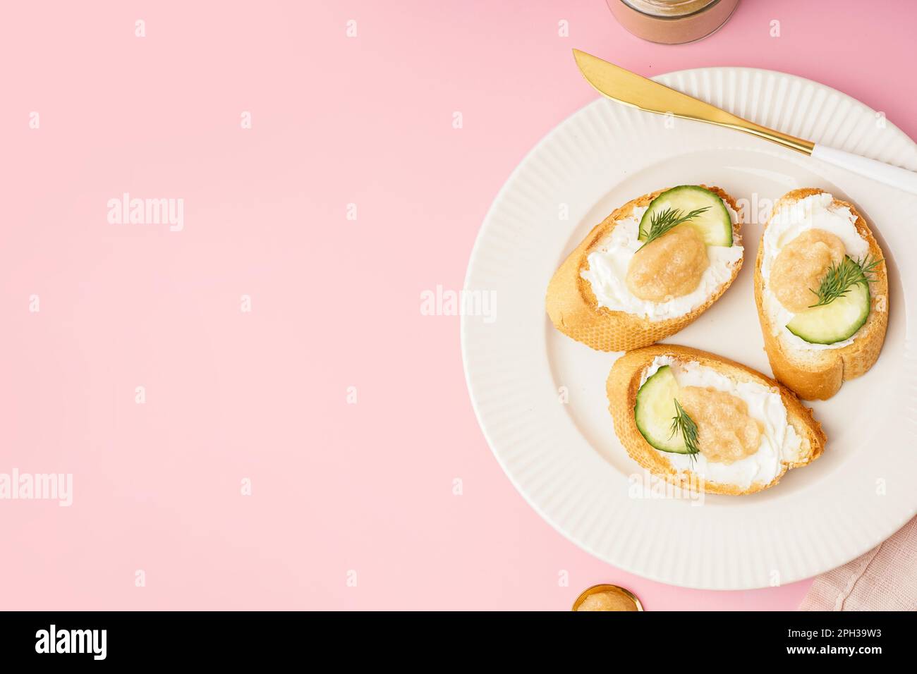 Delicious canapes with caviar of capelin on pink background Stock Photo ...