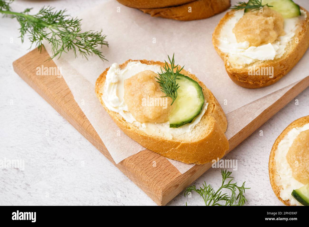 Delicious canapes with caviar of capelin on white background Stock ...